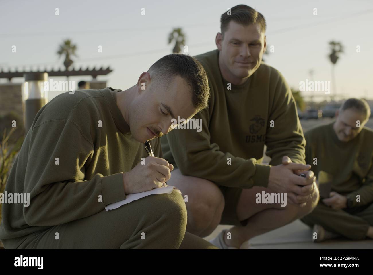 U.S. Marine Corps Capt. Mark Hammond, left, the assistant air officer ...