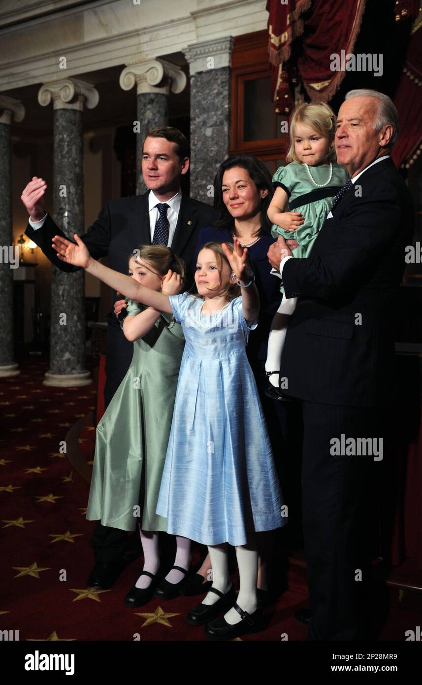 Sen. Michael Bennet, D-Colo., left, encourages the rest of his family ...