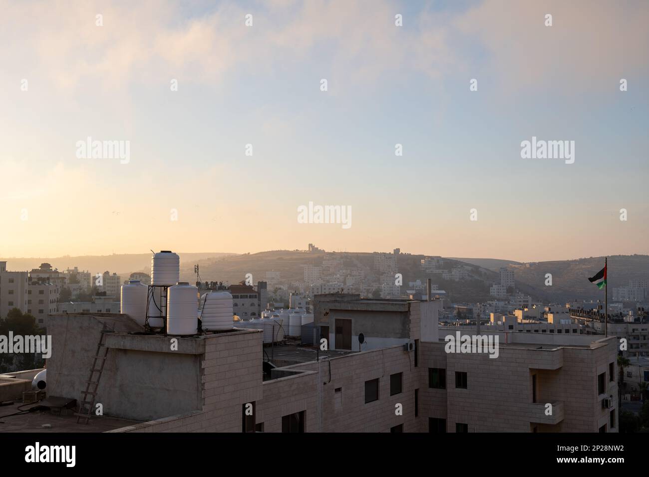 Ramallah Cityscape at Dawn with High Buildings and Mountains Facing the ...
