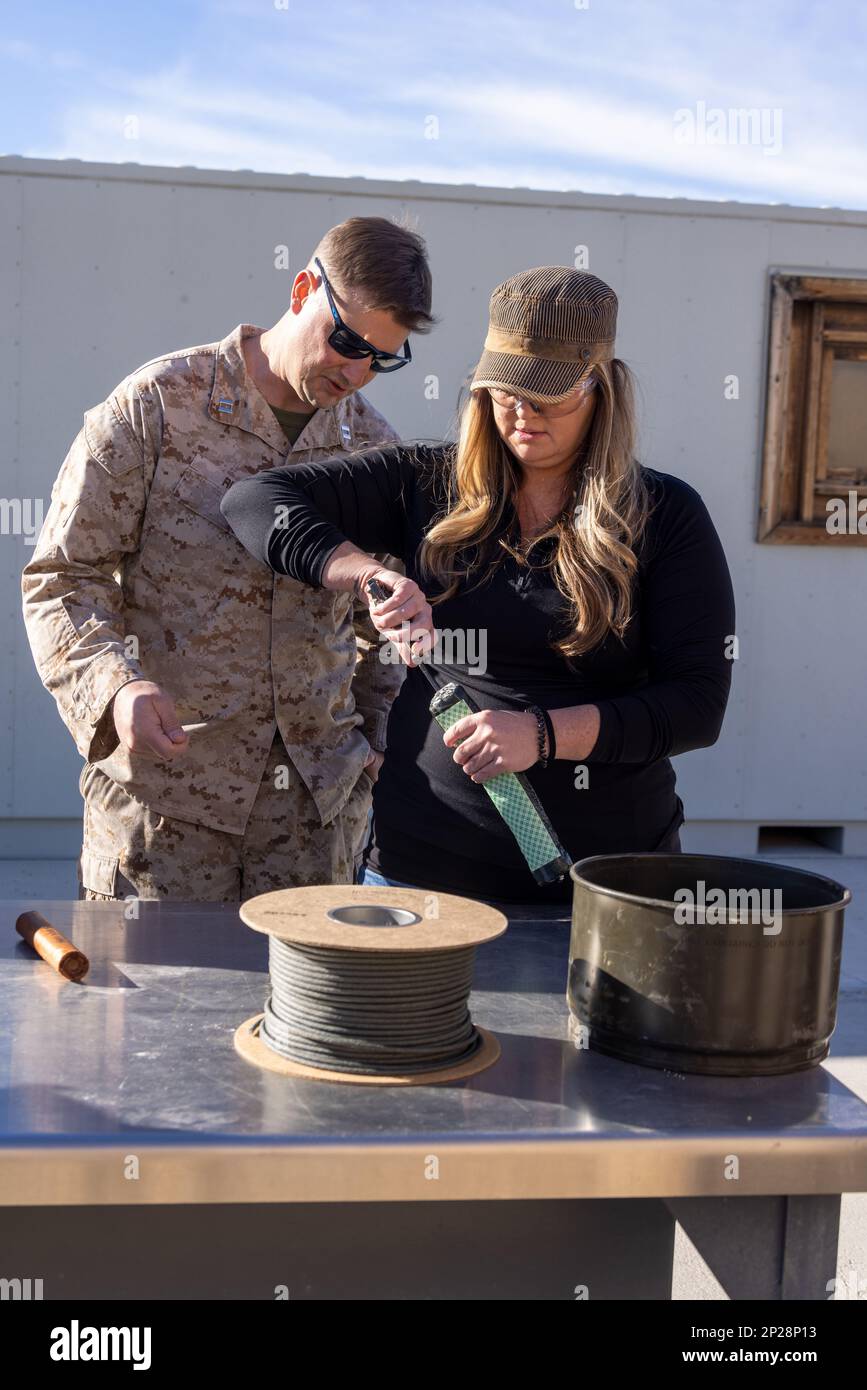 U.S. Marine Corps Capt. Clayton J. Rue, left, explosive ordnance ...