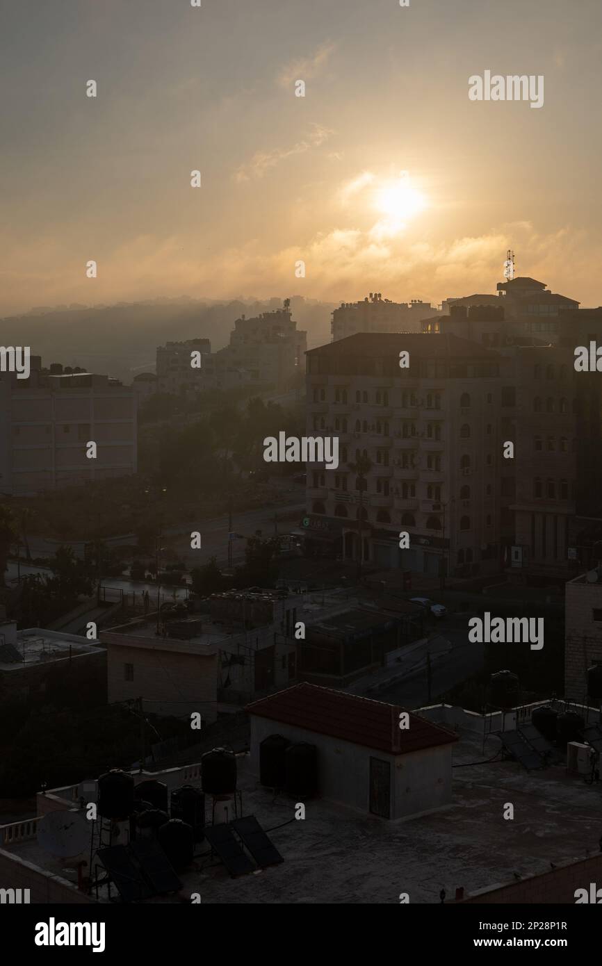 Vertical Ramallah Cityscape Facing the Sunset with High Buildings and ...