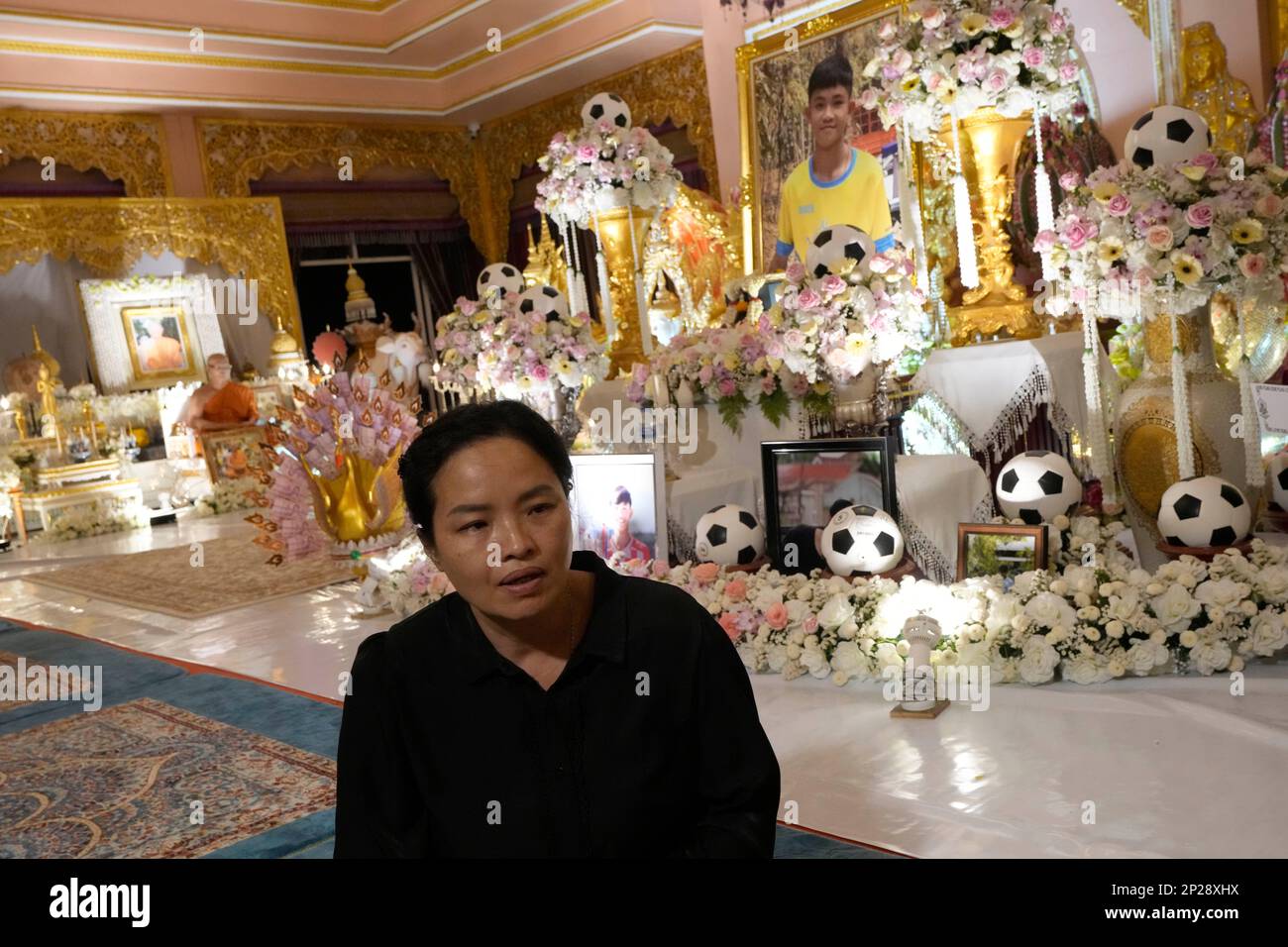 Thanaporn Phromthep talks to a reporter in front of the ashes of her son Duangphet Phromthep at ...