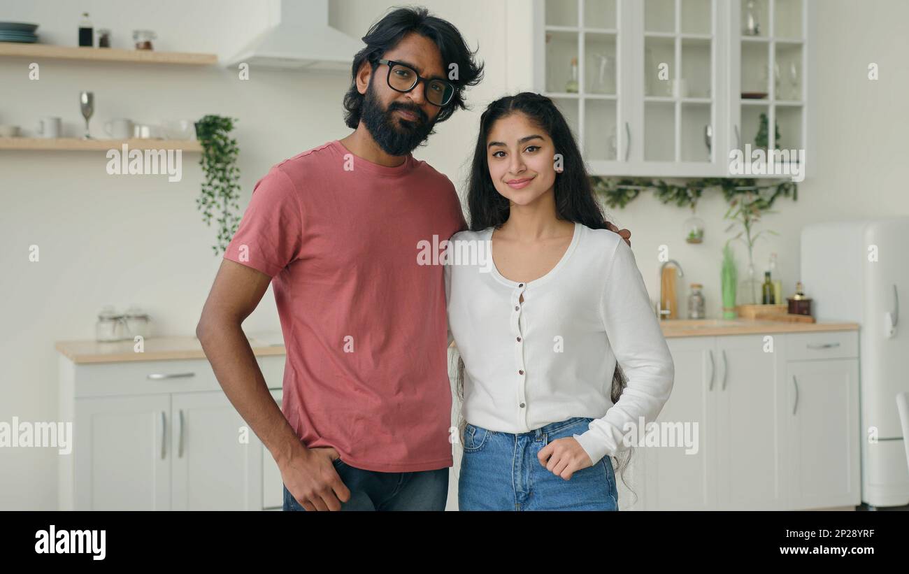 Portrait of two people multiracial couple in love posing in domestic ...