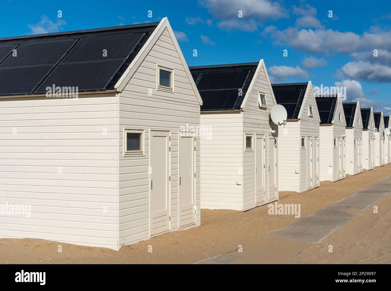 Row of white wooden beach houses with solar panels at seaside resort Katwijk aan Zee Stock Photo ...