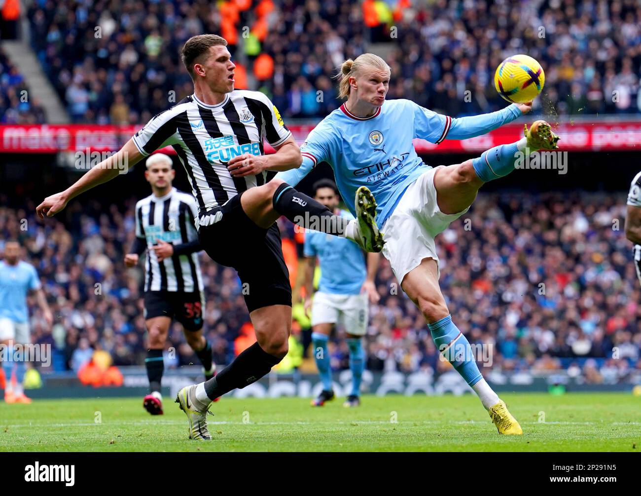 Manchester City's Erling Haaland (right) and Newcastle United's Sven ...