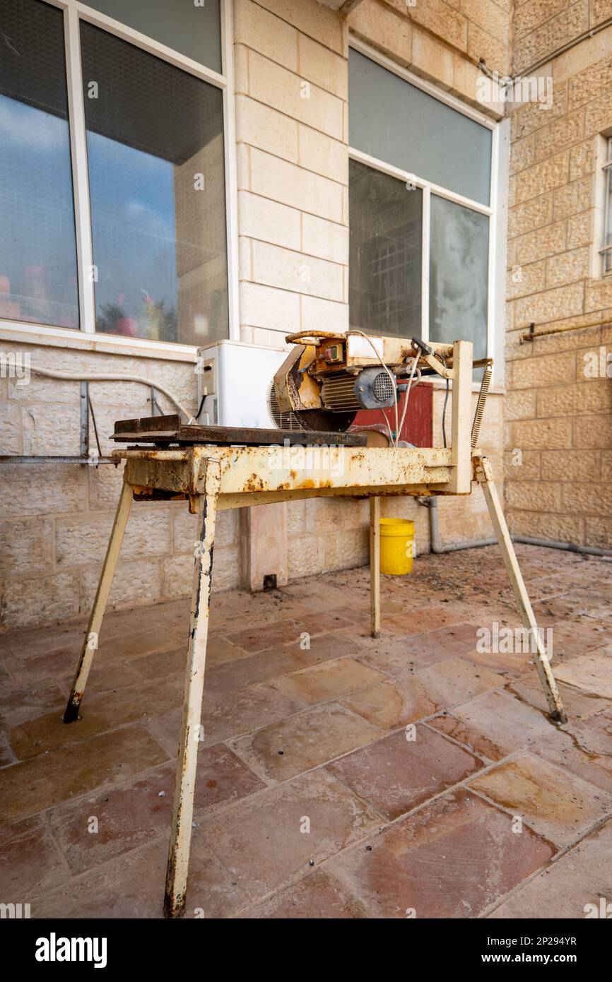 Old Rusty Electric Miter Table on Stand Stock Photo - Alamy