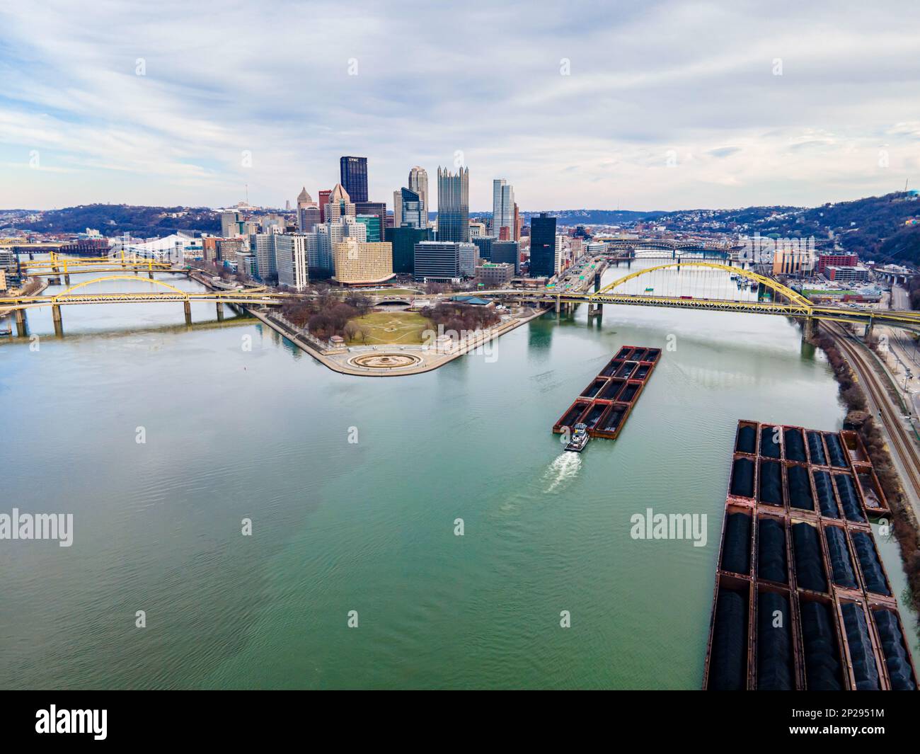 A towboat pushes barges of coal at the confluence of Pittsburgh from ...