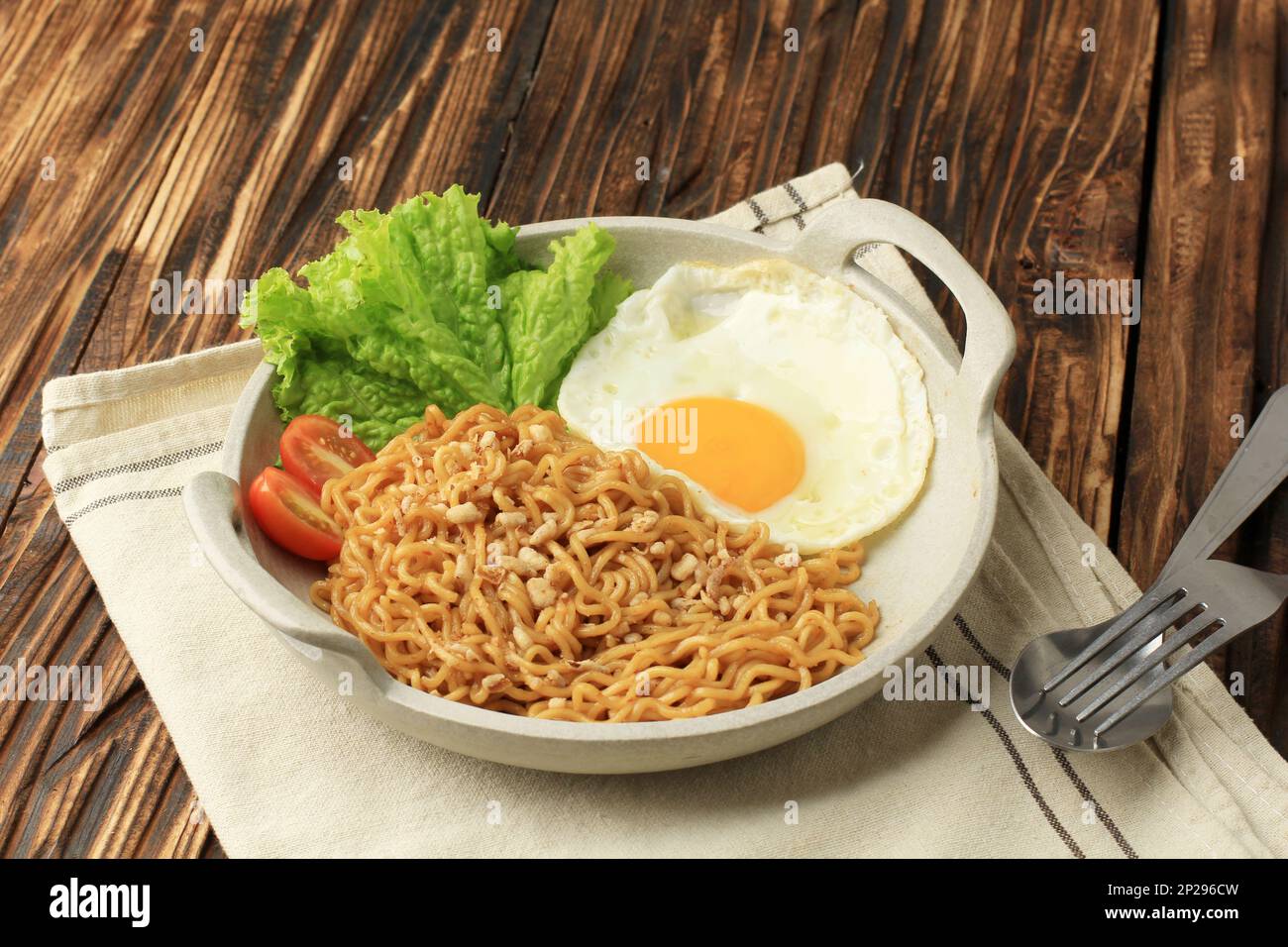 Indomie Goreng or Mie Goreng, Indonesian Popular Instant Noodle. Served ...