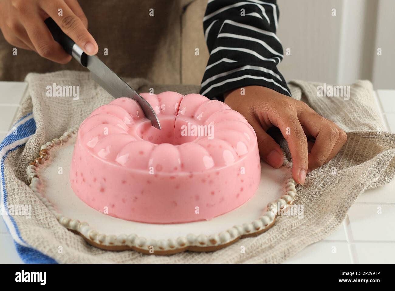 Asian Female Hand Slicing Pink Pearl Mung Bean Pudding in the Kitchen ...