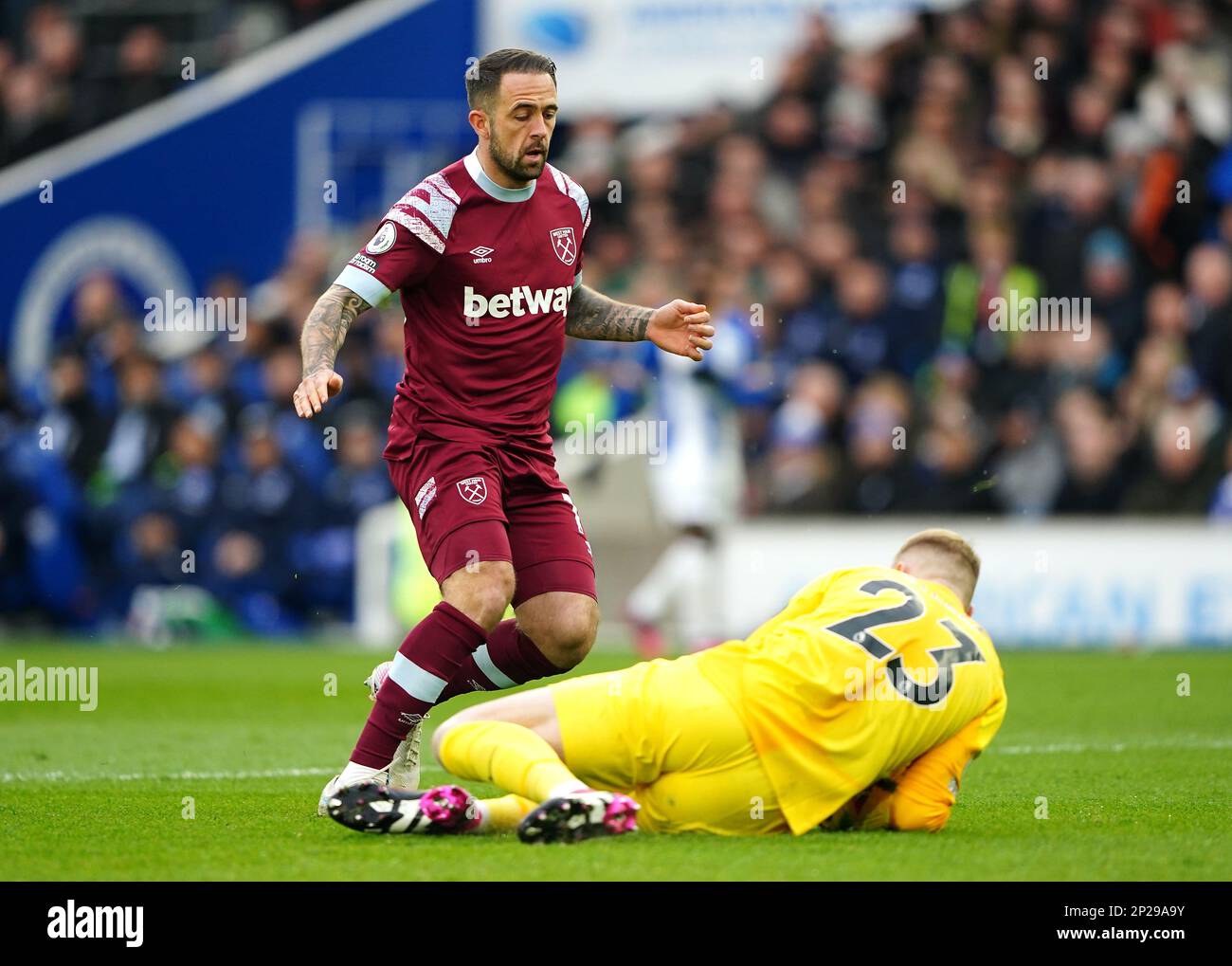 Brighton and Hove Albion goalkeeper Jason Steele (right) makes a save ...