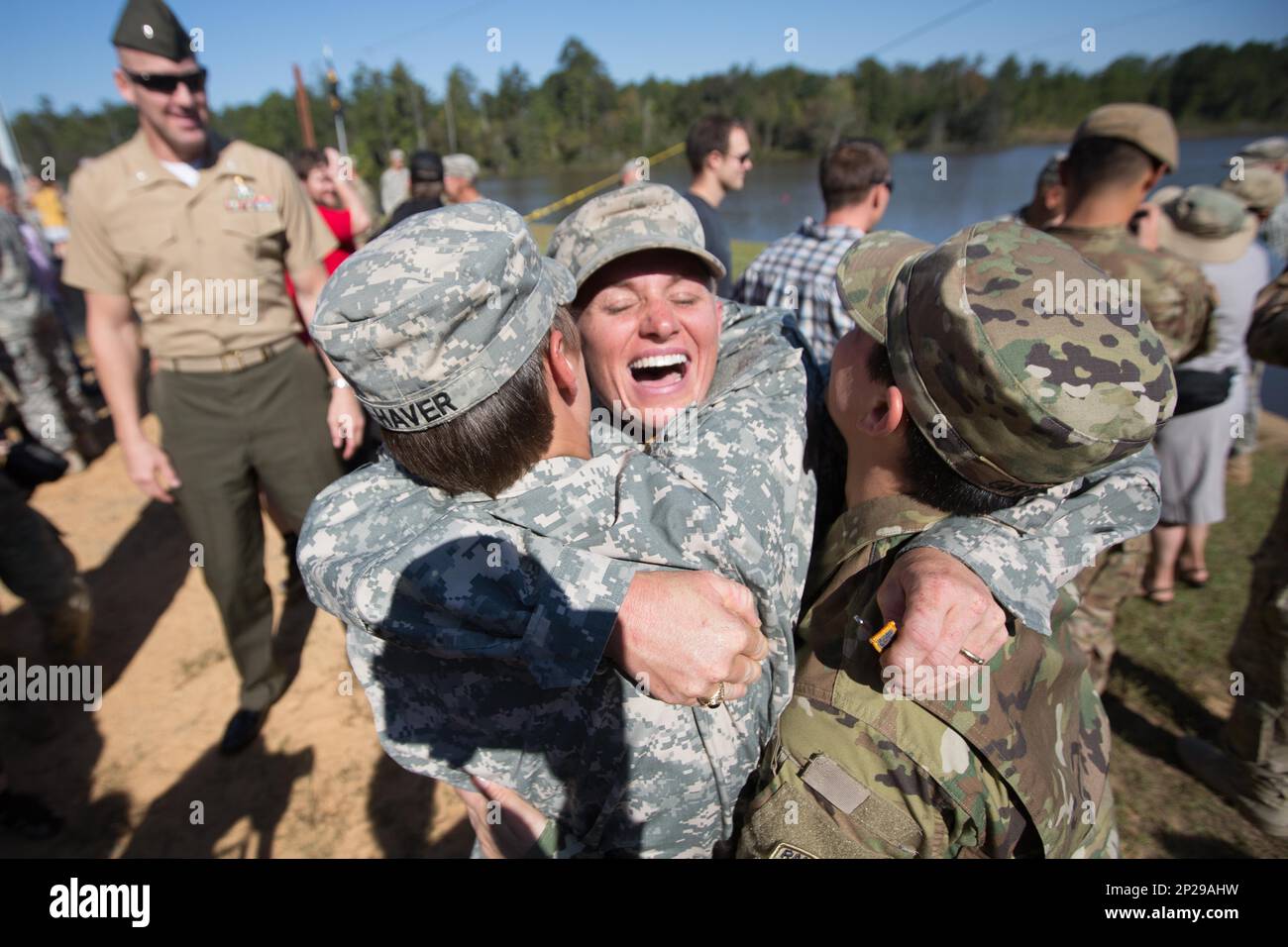 Maj. Lisa Jaster, center, embraces First Lt. Shaye Haver, left, and U.S ...
