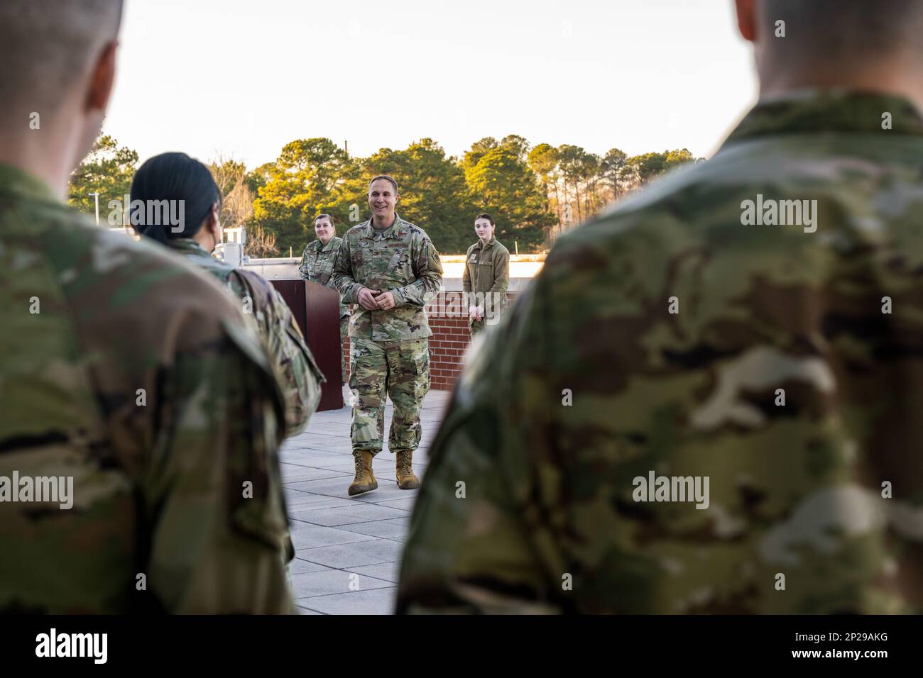 Col. Lucas Teel, 4th Fighter Wing commander, congratulates members from ...