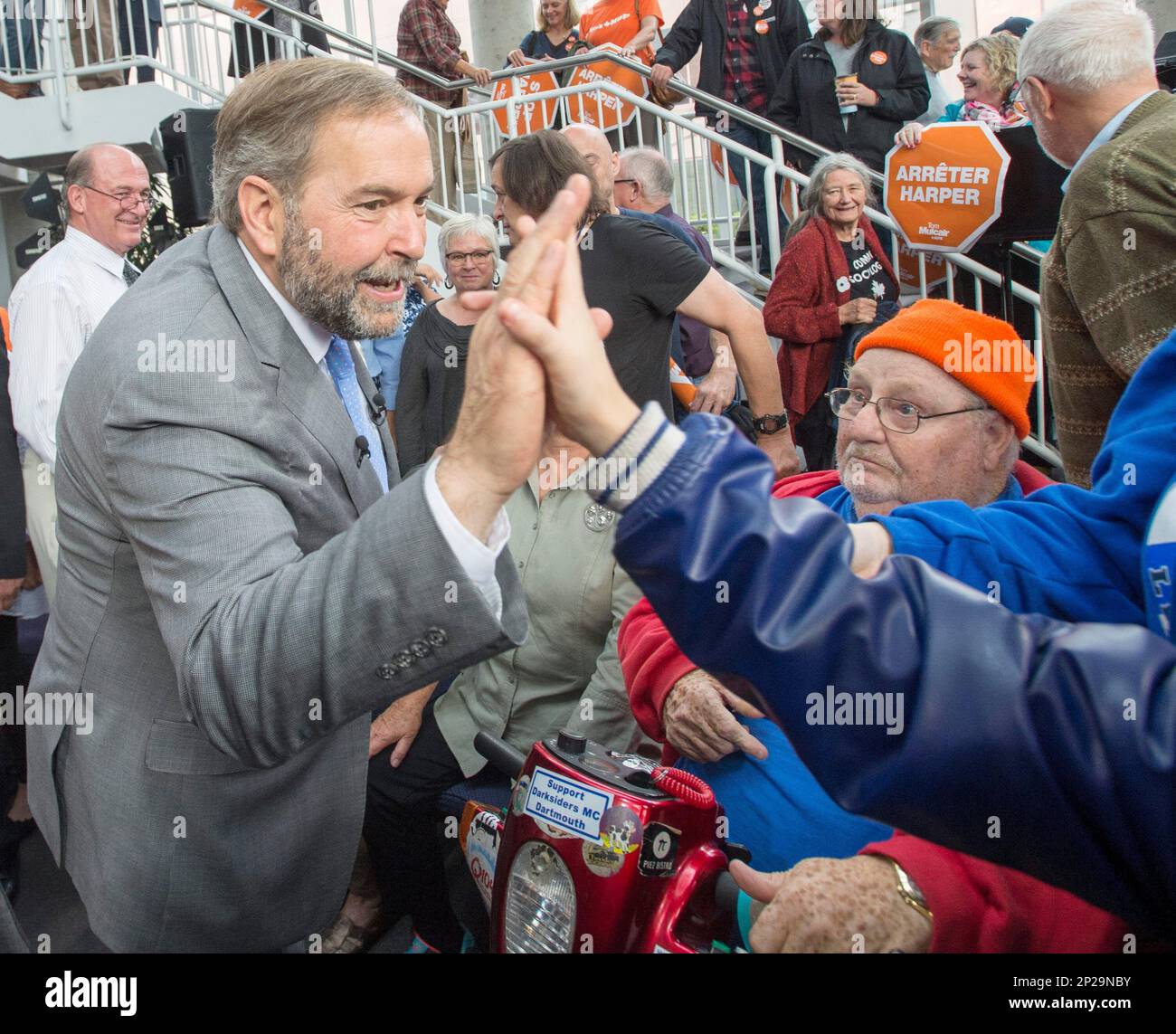 NDP Leader Tom Mulcair greets supporters after a town hall meeting in ...
