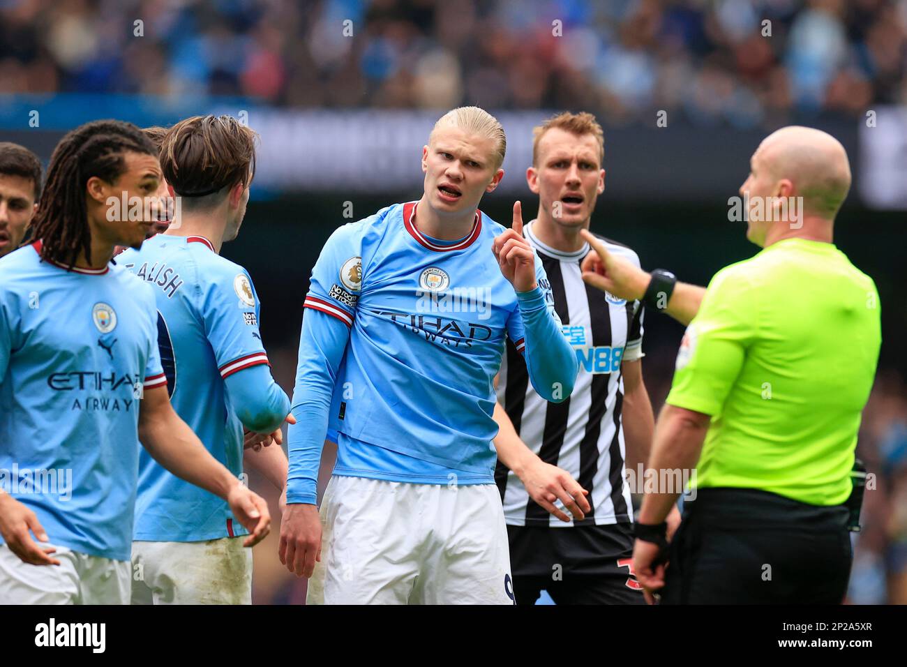 Erling Haaland #9 of Manchester City makes his case to referee Simon ...