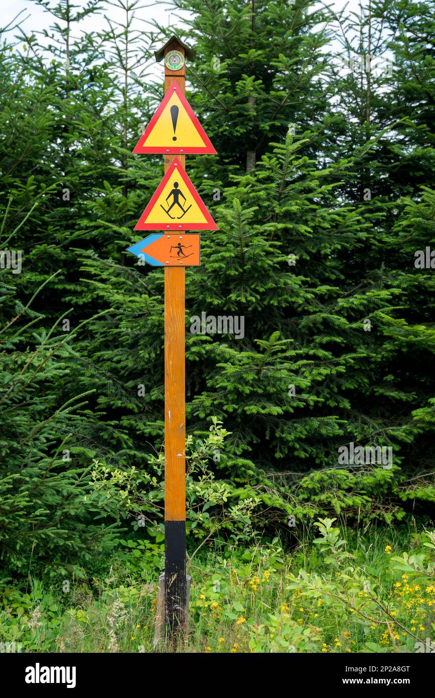 Blue marking of the cross-country skiing trail. Plates on the pole ...