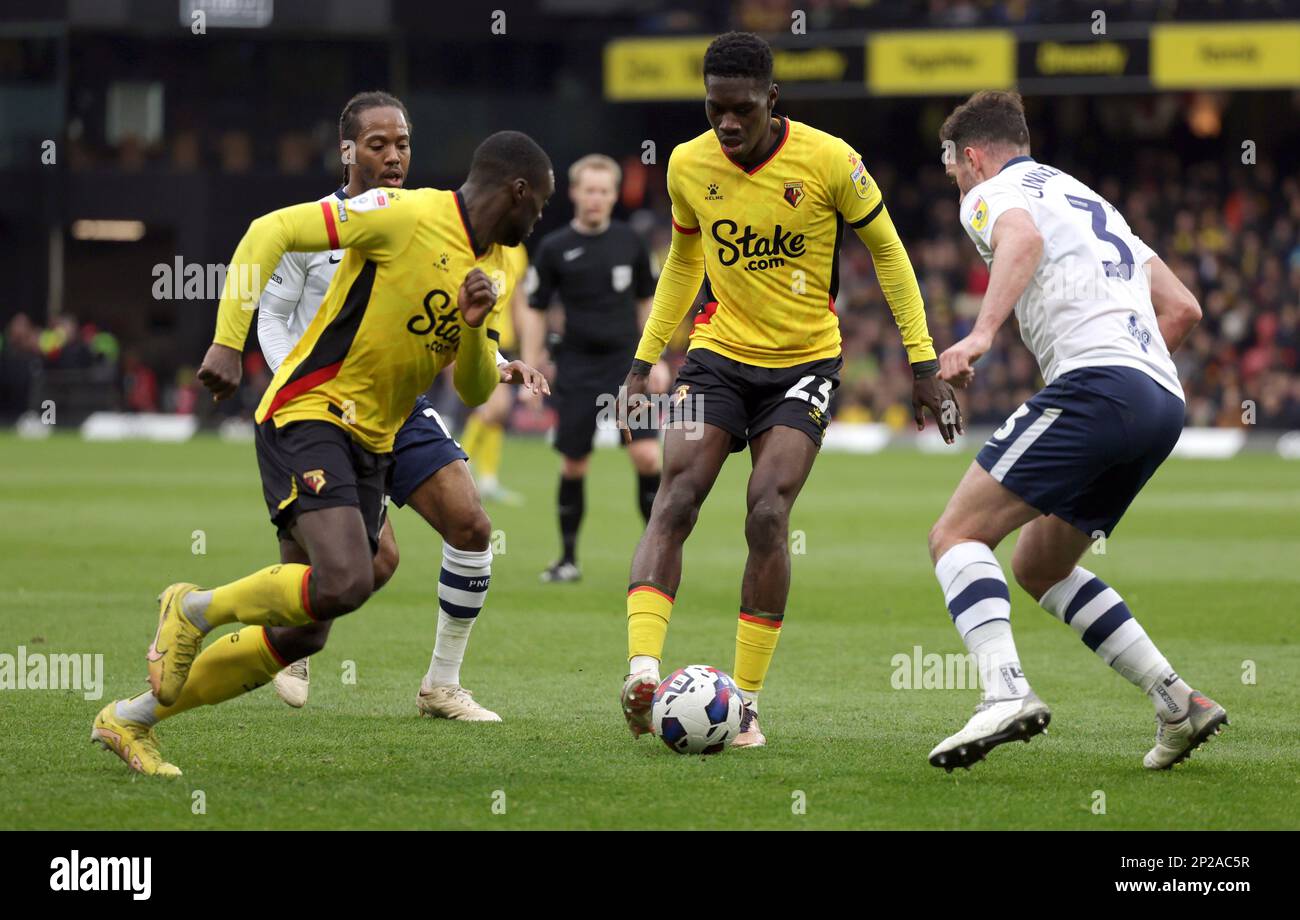 Watford's Ismaila Sarr (centre) and team mate Ken Sema in action ...