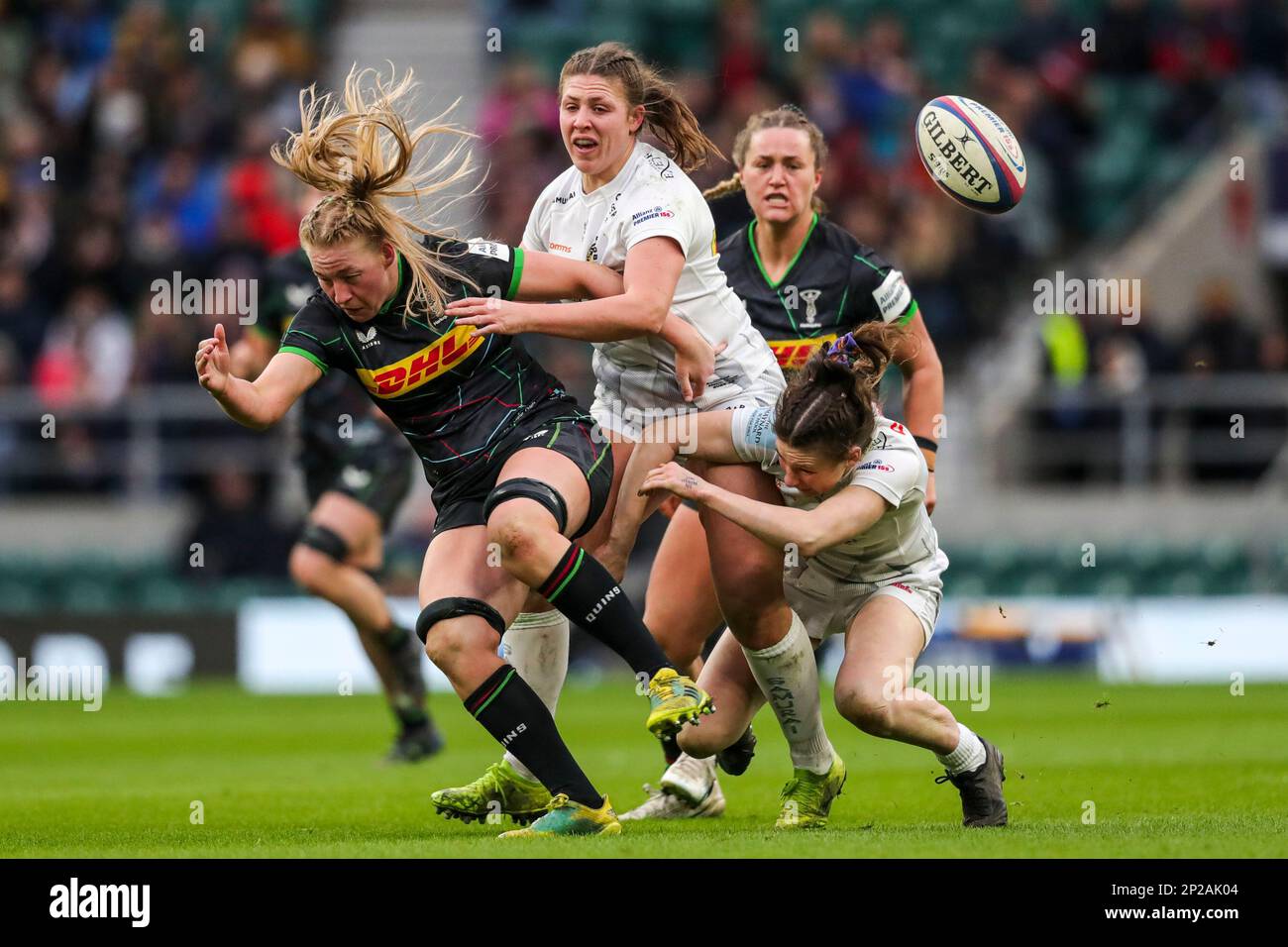 Harlequins' Lauren Brooks with Exeter Chiefs' Daleaka Menin and Flo ...