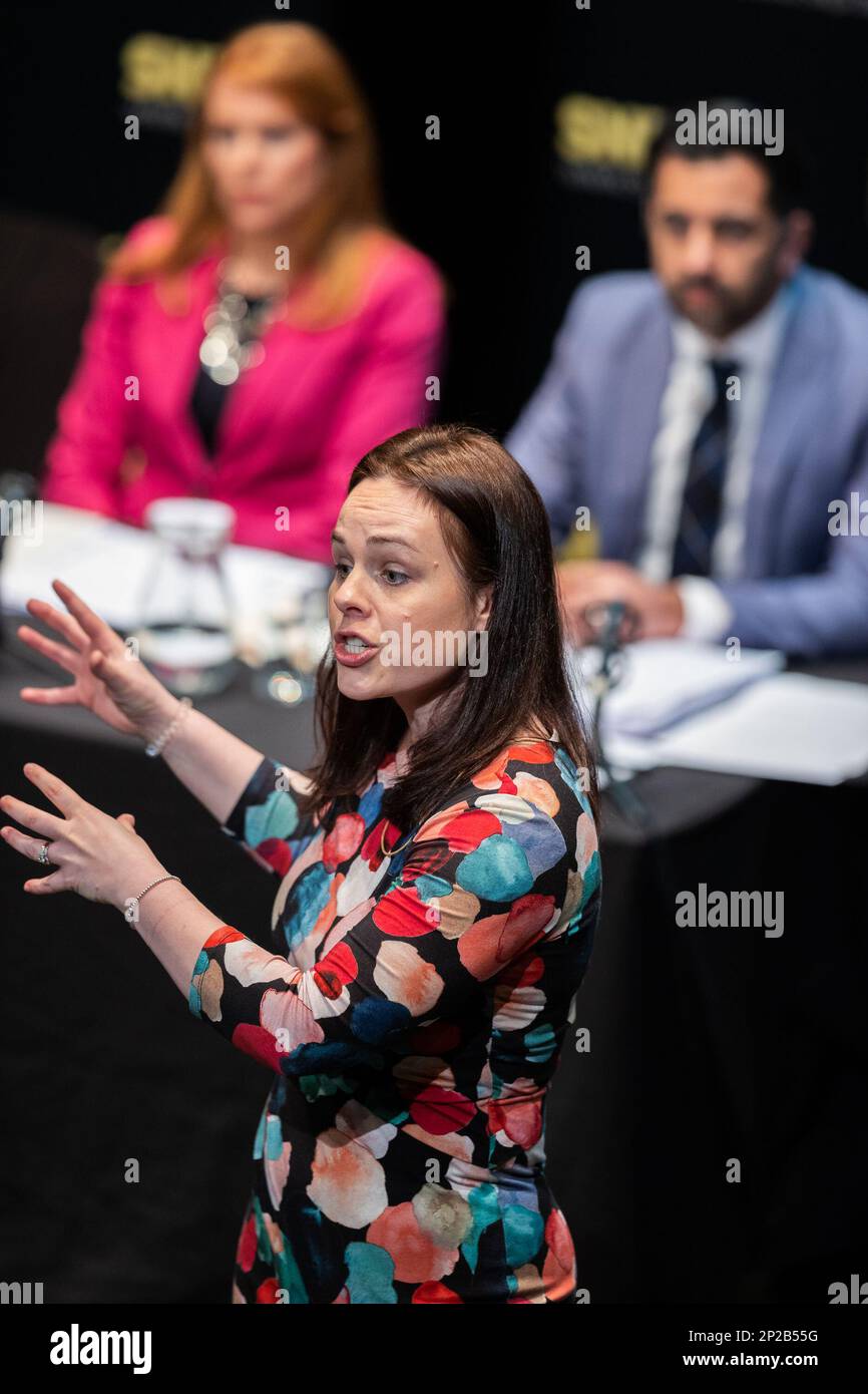 Kate Forbes speaking, with Ash Regan and Humza Yousaf behind, at an SNP ...