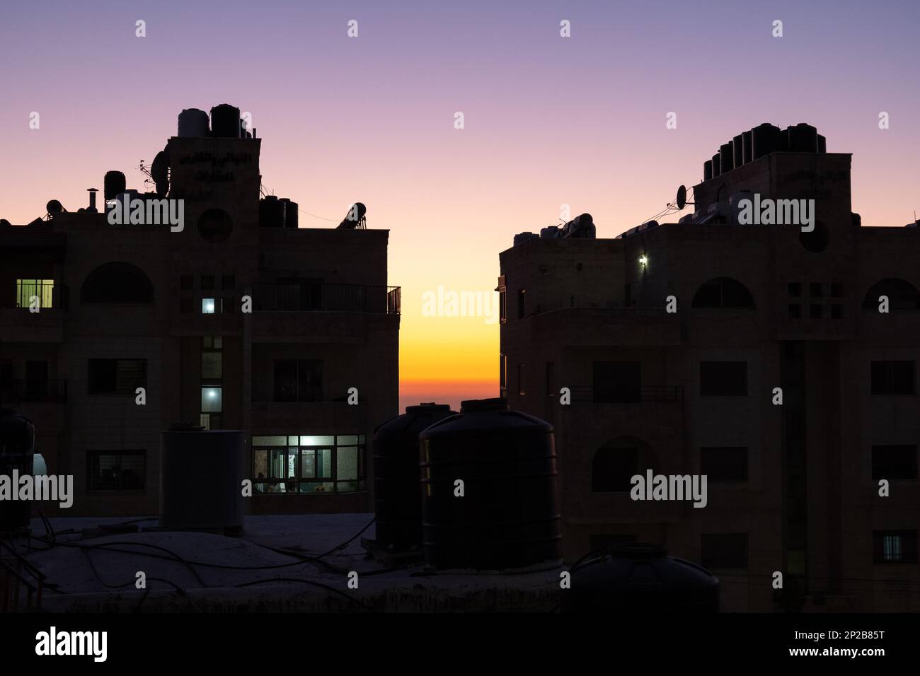Arab Town Building Silhouettes at Twilight with Water Tanks on Top and ...