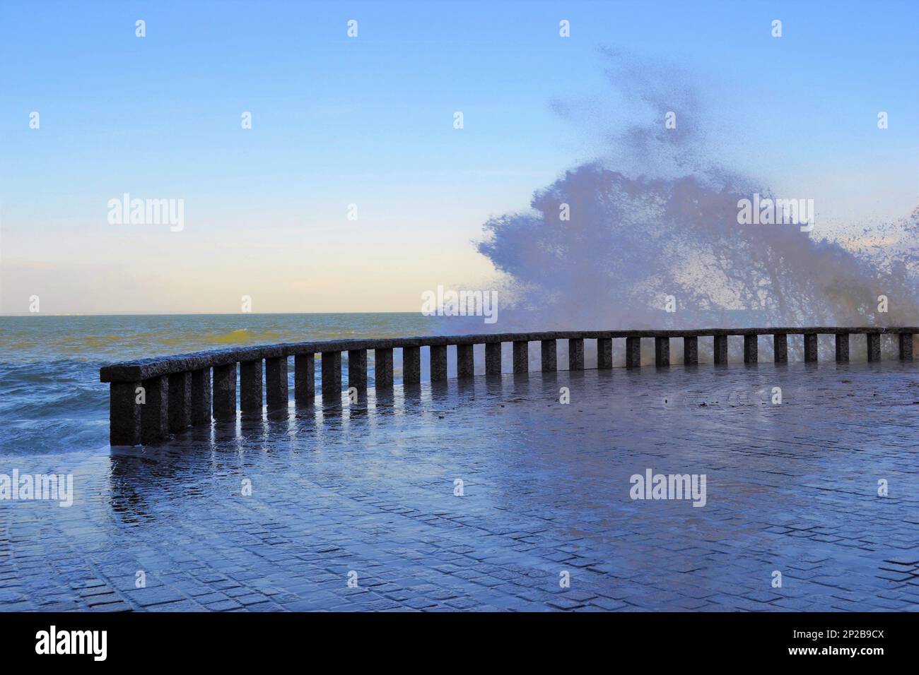 High tide with the waves crashing over La Digue in Pleneuf Val Andre ...