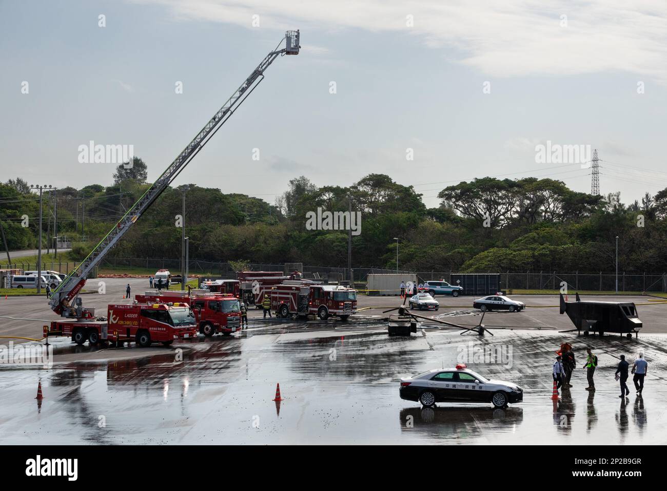 U.S. and Japanese first responders cordon off the aftermath of a ...