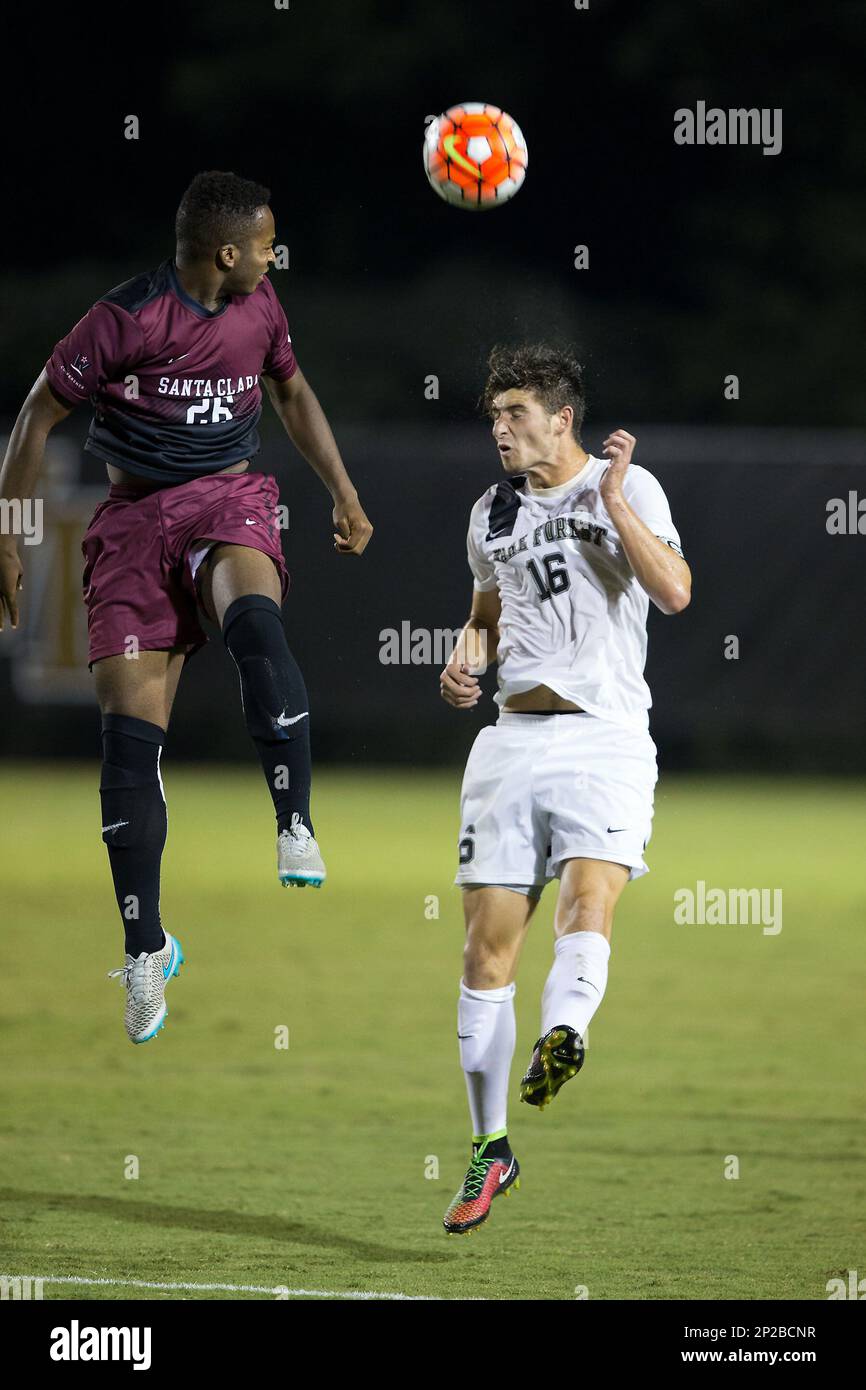 Ian Harkes (16) of the Wake Forest Demon Deacons heads the ball away ...