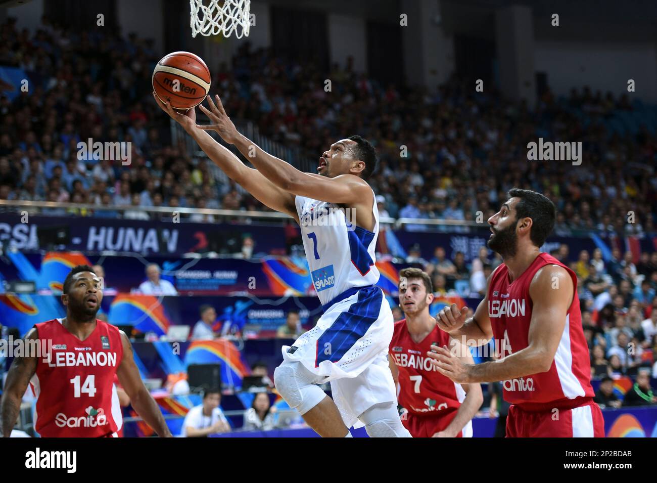 Jayson William of the Philippines, white, goes for the basket during a ...