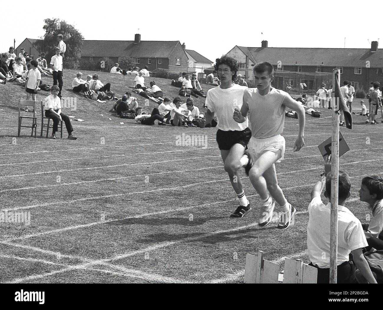 1989, a sports day at a secondary school, two teenage males competing ...