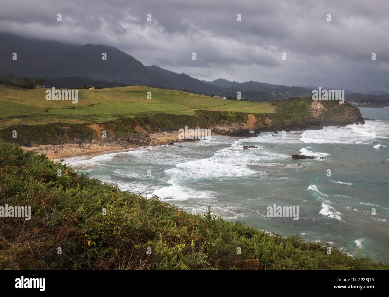 A tranquil landscape of rolling cliffs, a peaceful bay and the vast ...