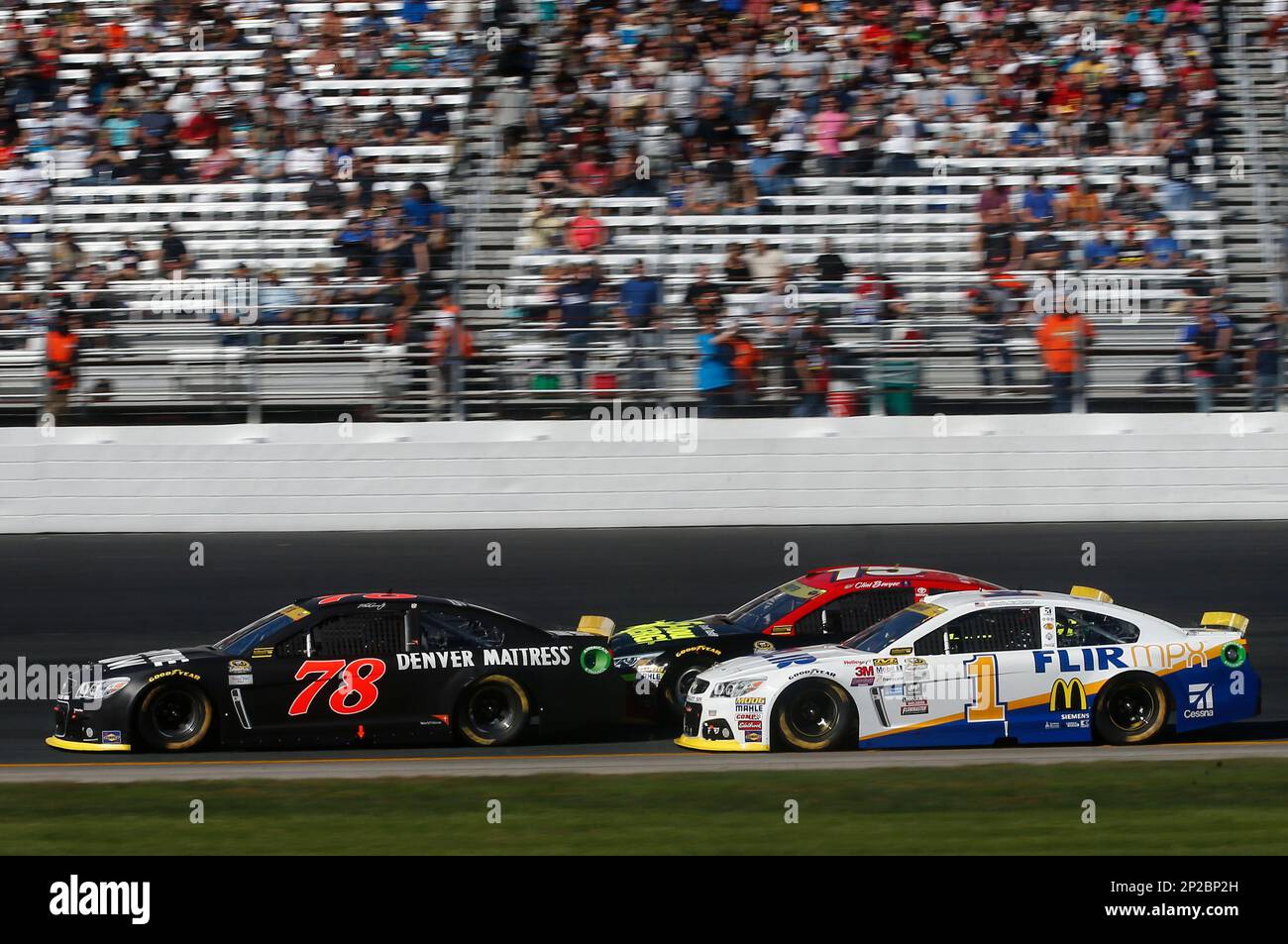 Martin Truex Jr. (78), Jamie McMurray (1), and Clint Bowyer (15) during ...