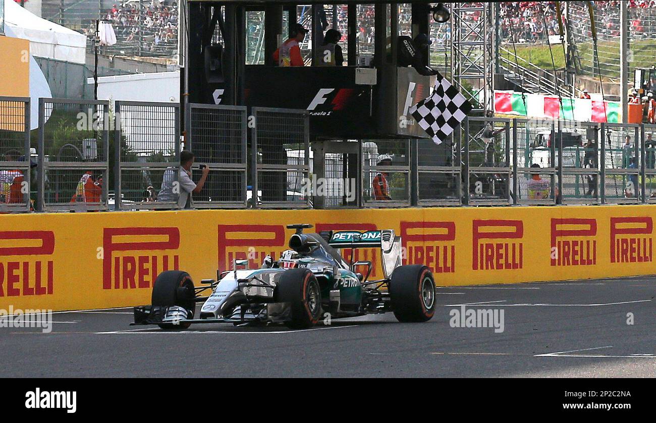 Mercedes driver Lewis Hamilton of Britain crosses the finish line to ...