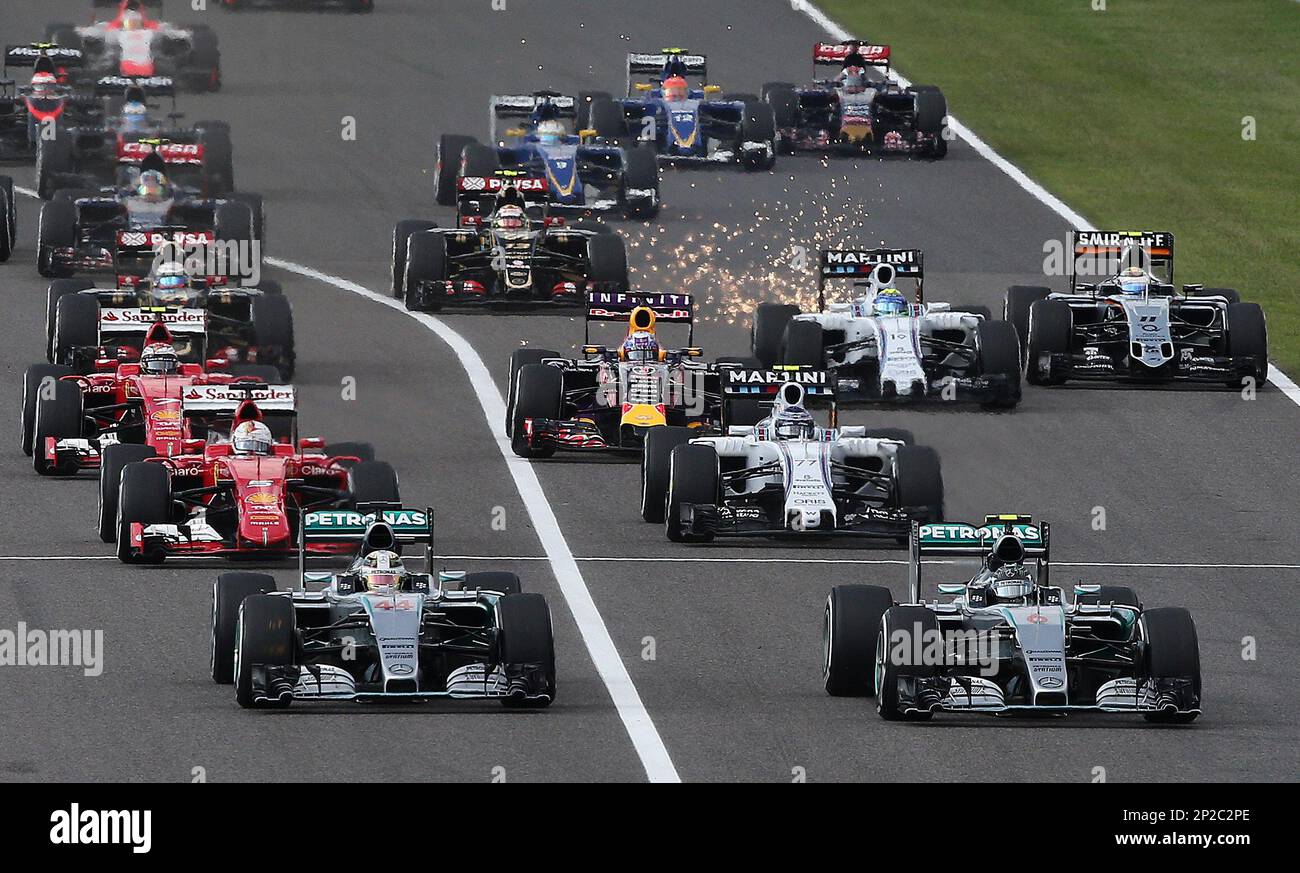 Cars race to turn one at the start of the Japanese Formula One Grand ...
