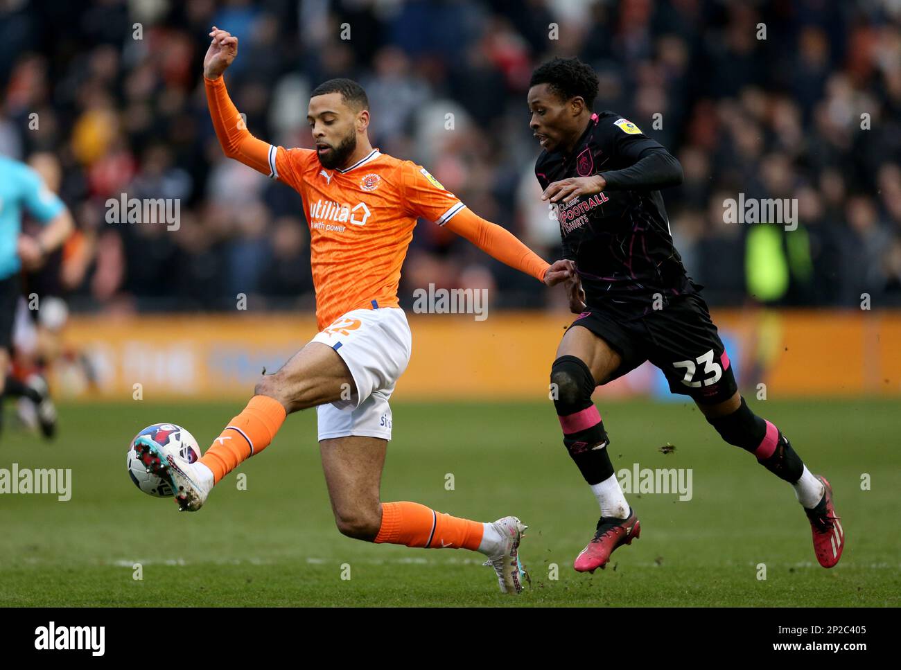 Blackpool's CJ Hamilton (left) and Burnley's Nathan Tella battle for ...