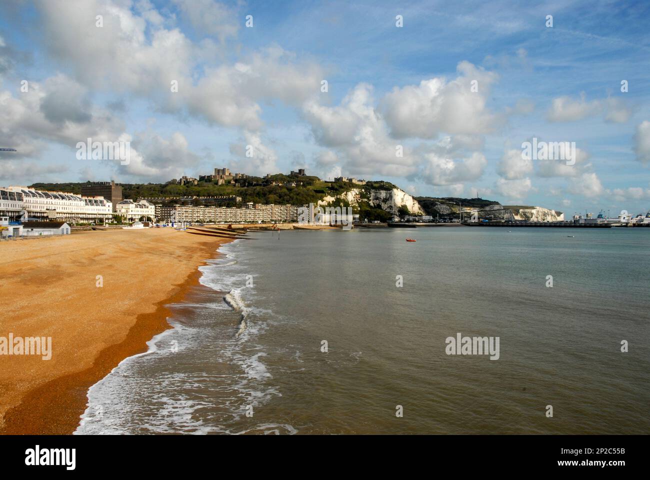 The sandy seafront at Dover with the Dover castle in the background in ...