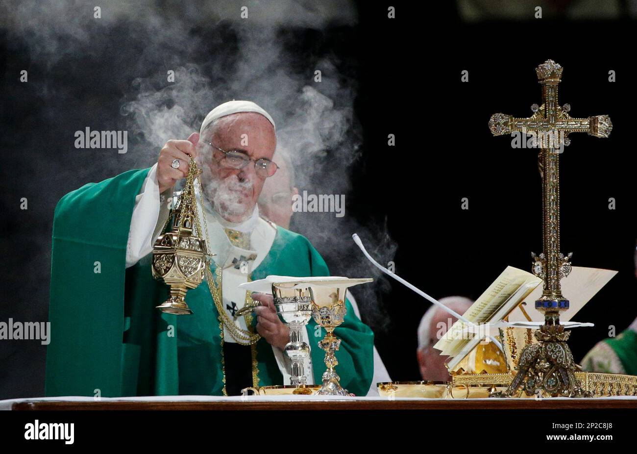 Pope Francis blesses the Eucharist with incense while celebrating Mass ...