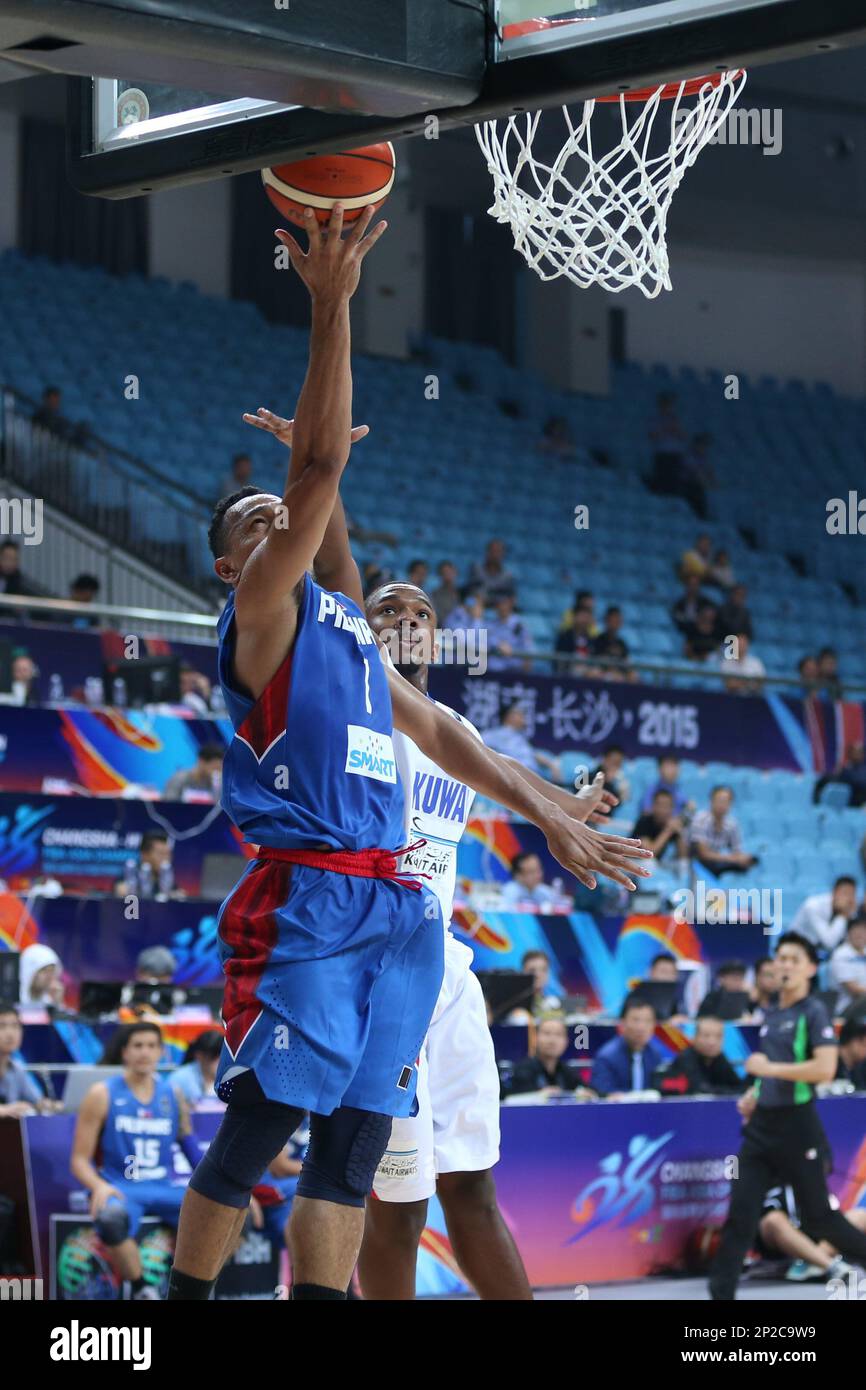 Jayson William of the Philippines, left, shoots over the defense of ...