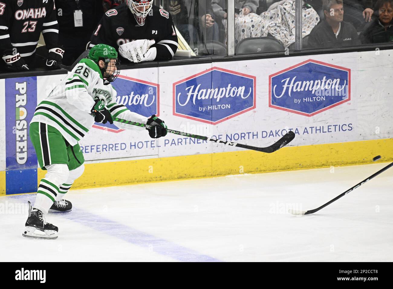 North Dakota Fighting Hawks forward Dylan James (26) passes the puck up ...