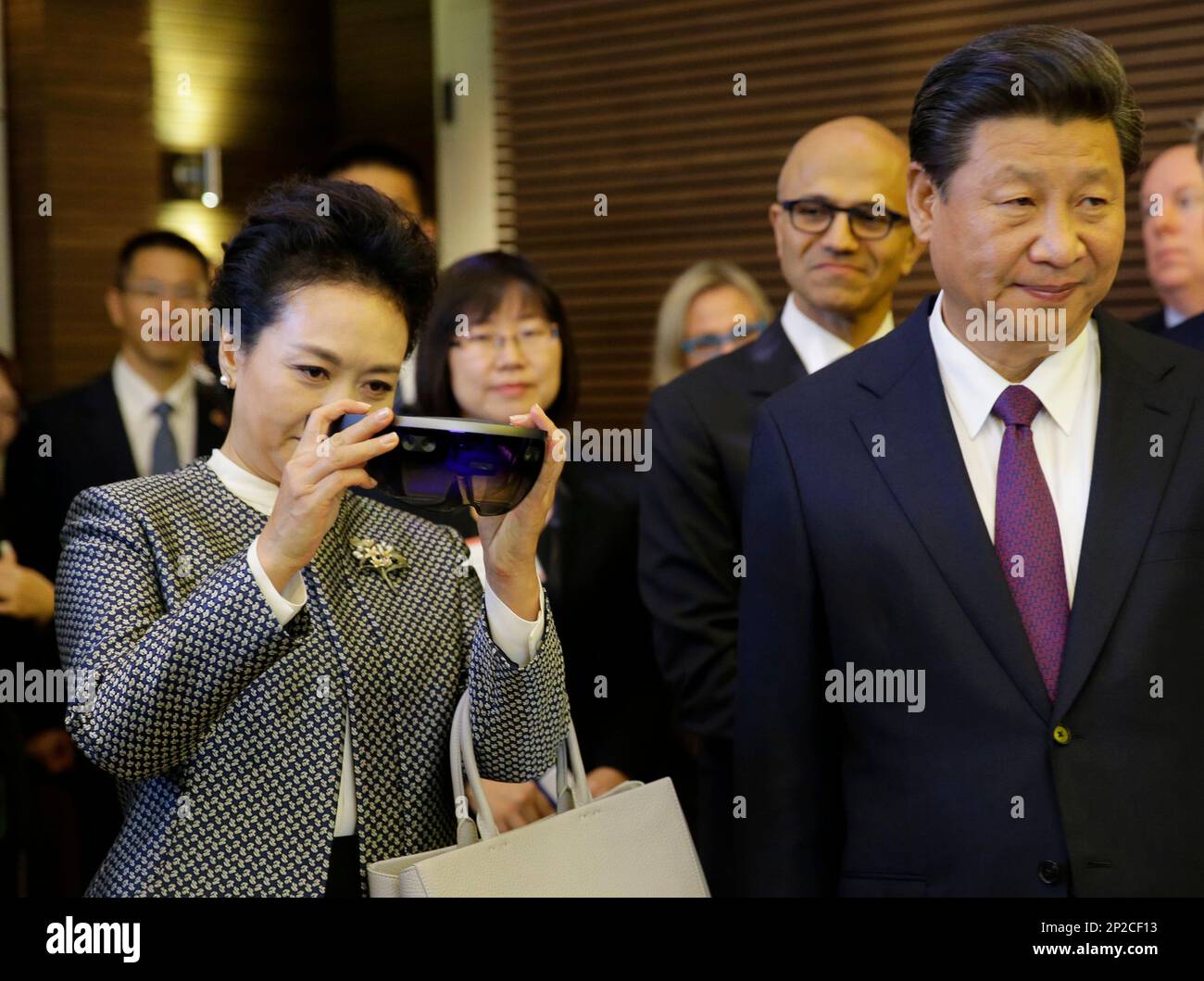 Peng Liyuan, left, stands next to her husband, Chinese President Xi ...