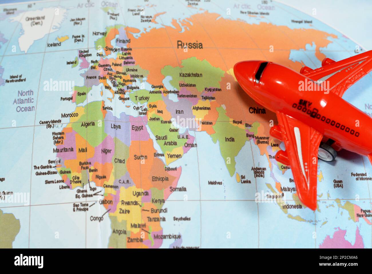 Colorful world map with airplane on it with the continents Africa ...