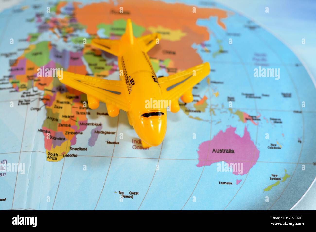 Colorful world map with airplane on it with the continents Africa ...
