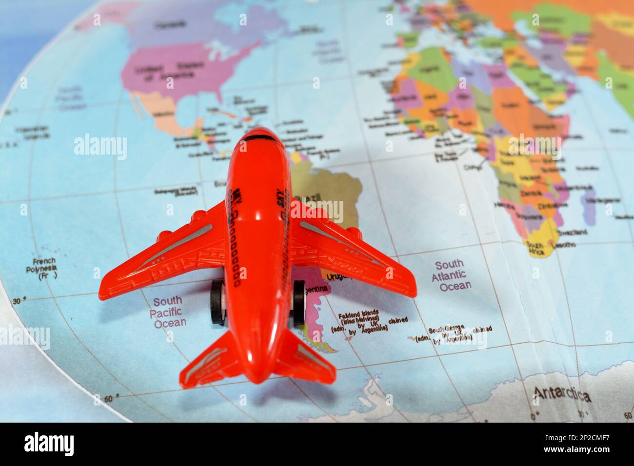 Colorful world map with airplane on it with the continents Africa ...