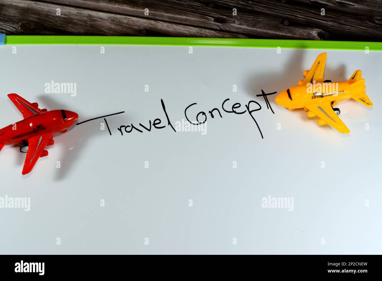 English text on a board ( Travel concept ) with a small airplane beside ...