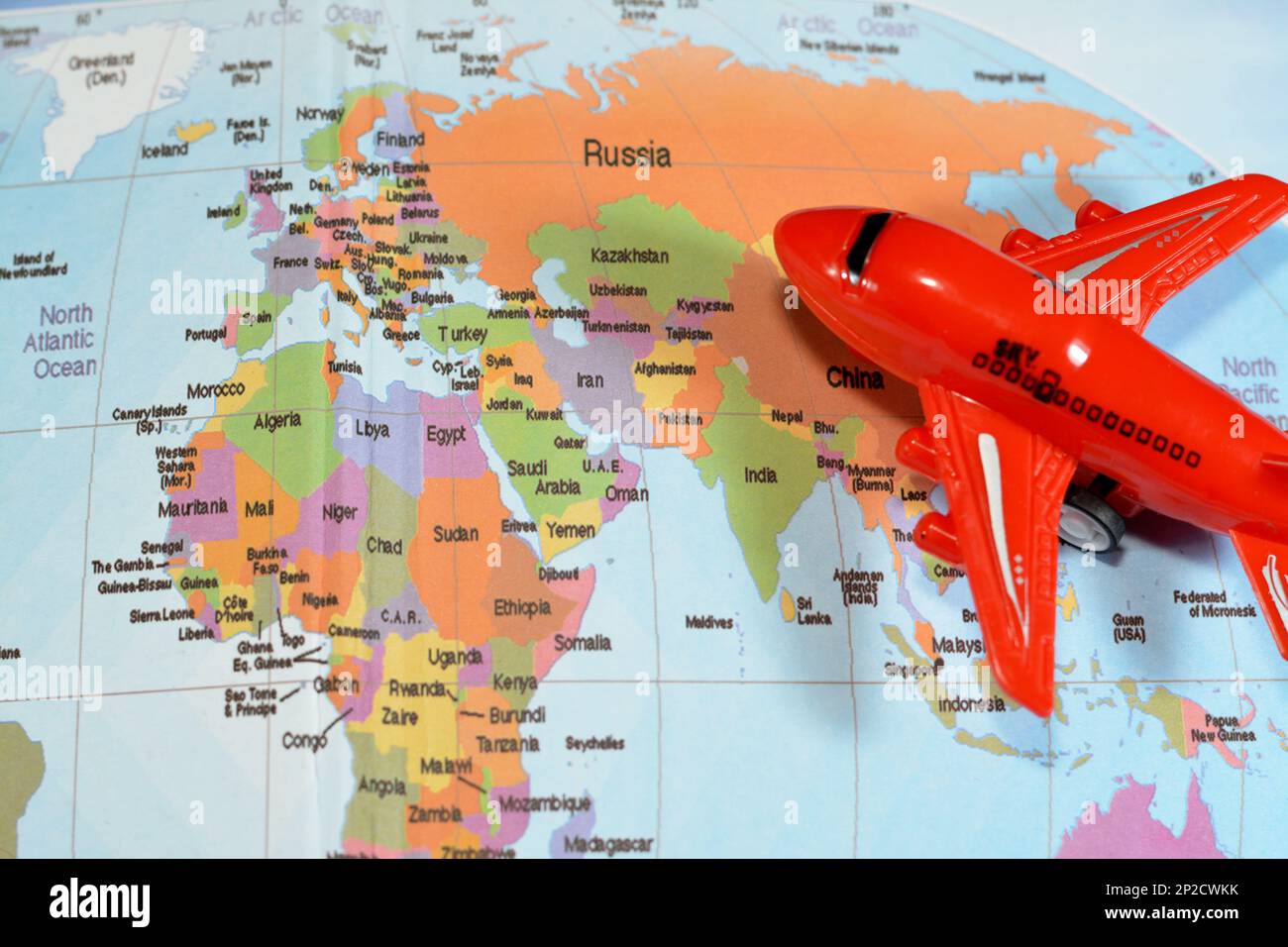 Colorful world map with airplane on it with the continents Africa ...