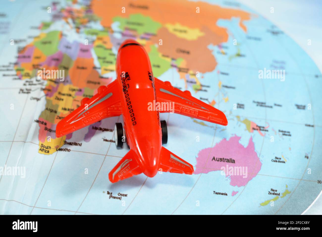 Colorful world map with airplane on it with the continents Africa ...