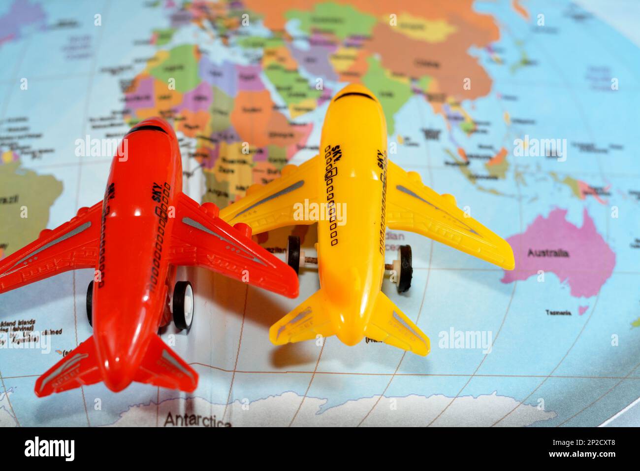 Colorful world map with airplane on it with the continents Africa ...