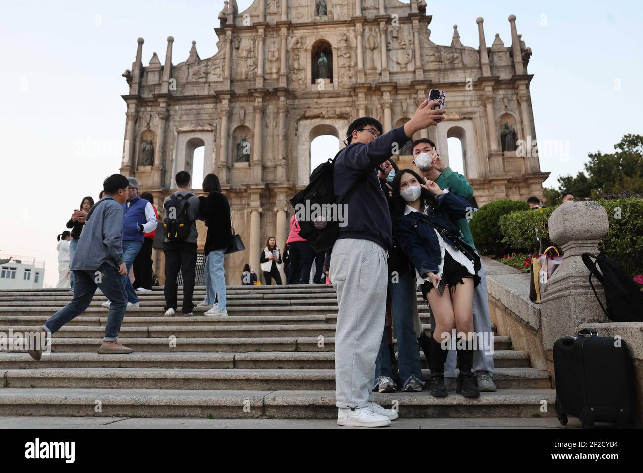 Travelers take off face mask at Ruínas de São Paulo in Macau during ...