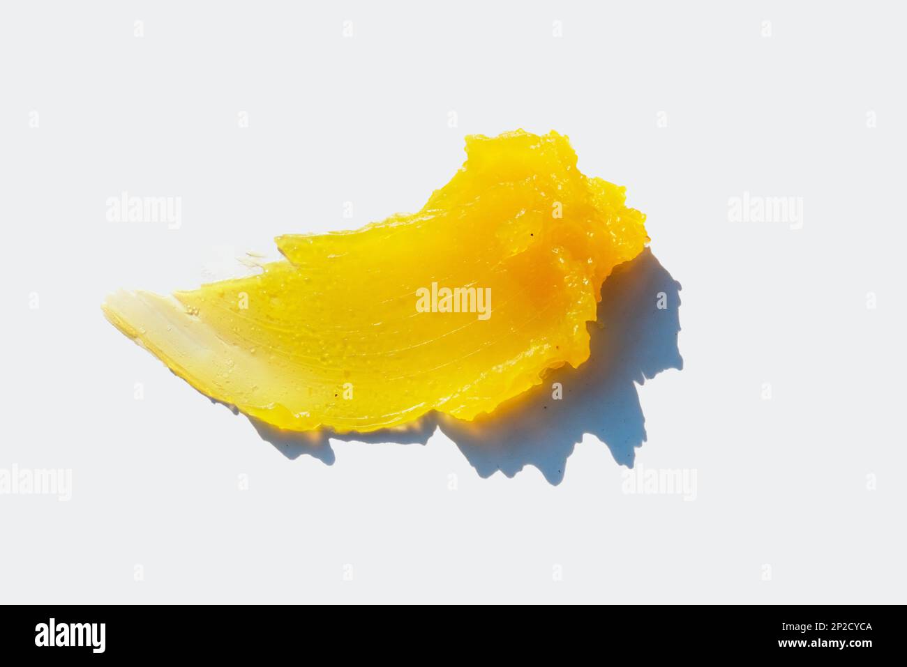 Close-up of a smear texture of yellow thick oil for skin care Stock ...