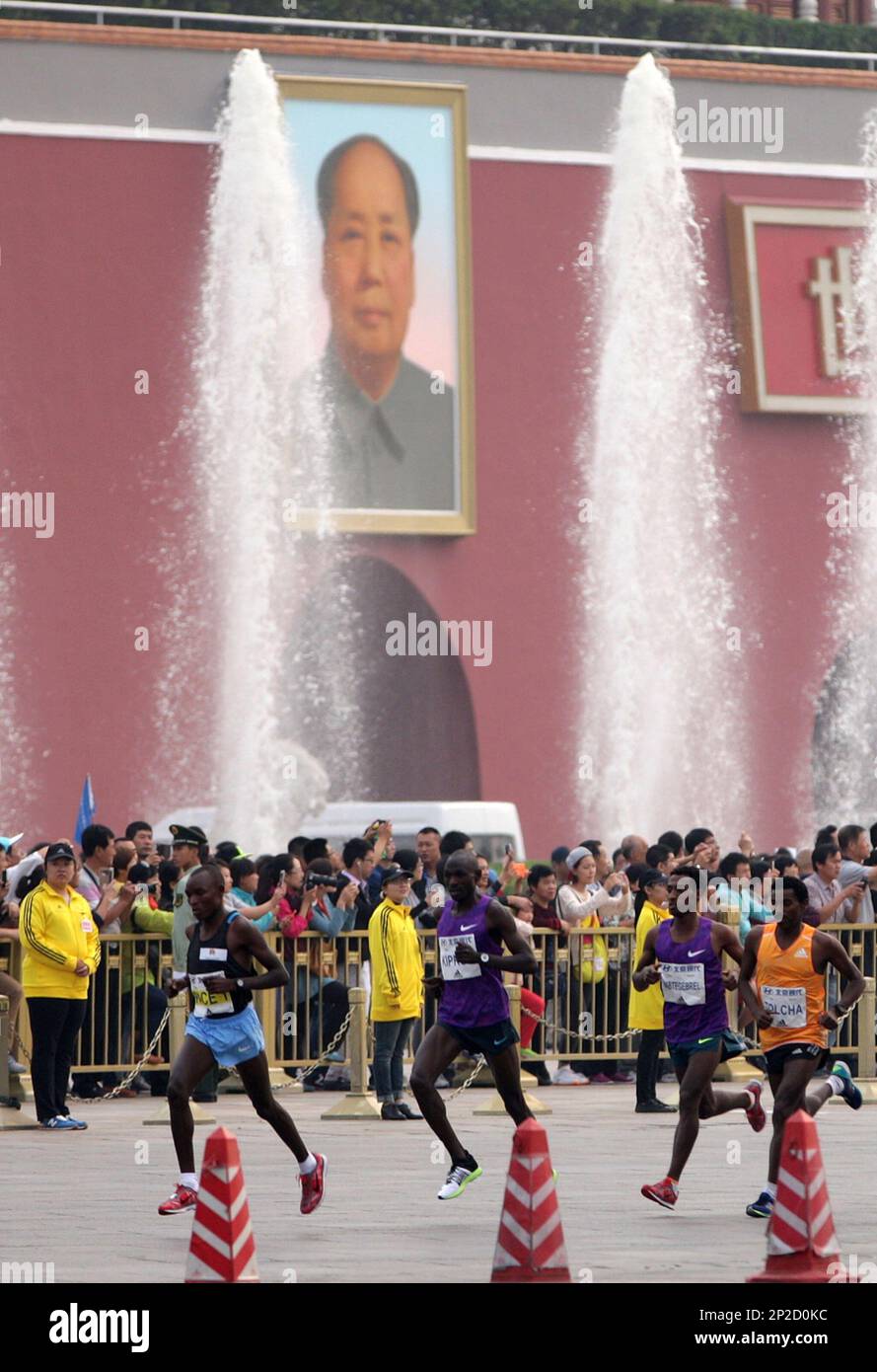 Foreign participants run past the Tian'anmen Rostrum during the 2015 ...
