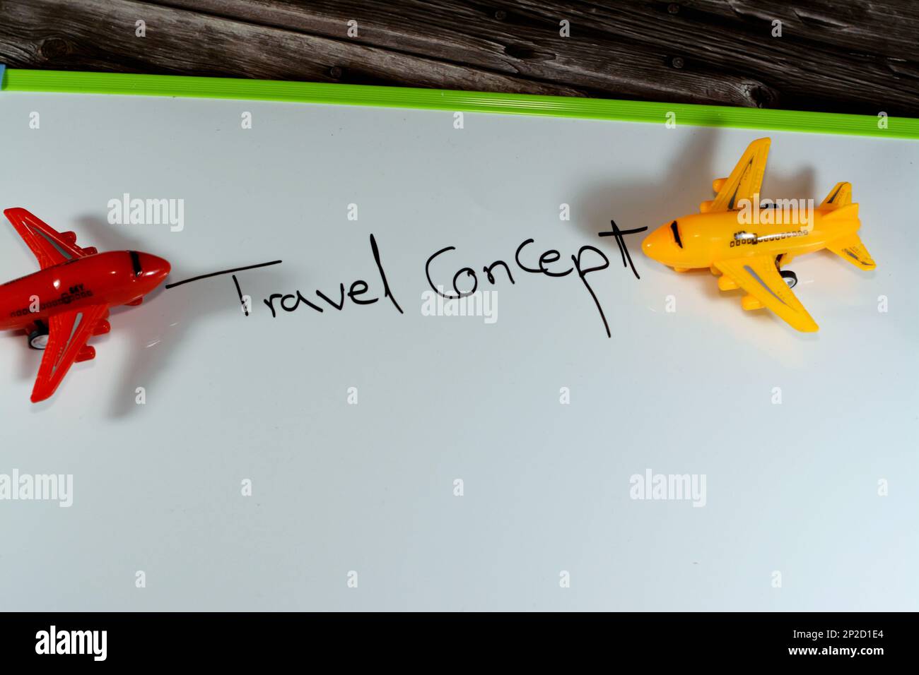 English text on a board ( Travel concept ) with a small airplane beside ...