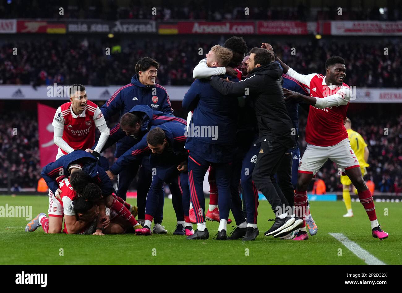 Arsenal players celebrate their sides third goal scored by Reiss Nelson ...